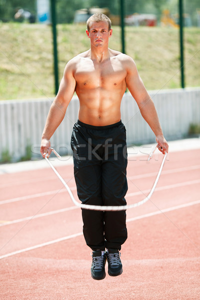 man skipping through field