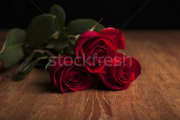 rose lying on table